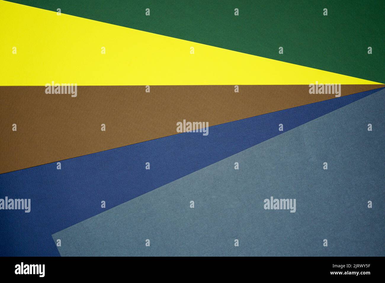 Brown, yellow, green, blue five tone color paper background with ...