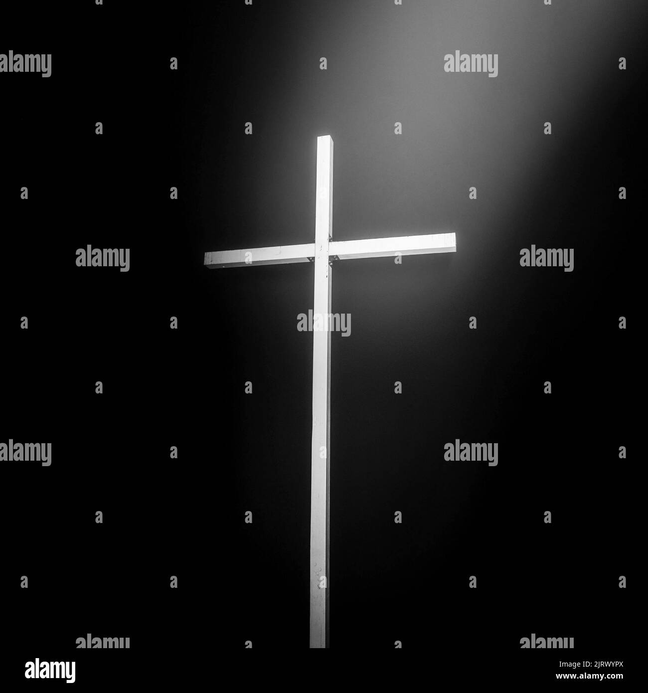 Light shinning down on Cross Stock Photo - Alamy