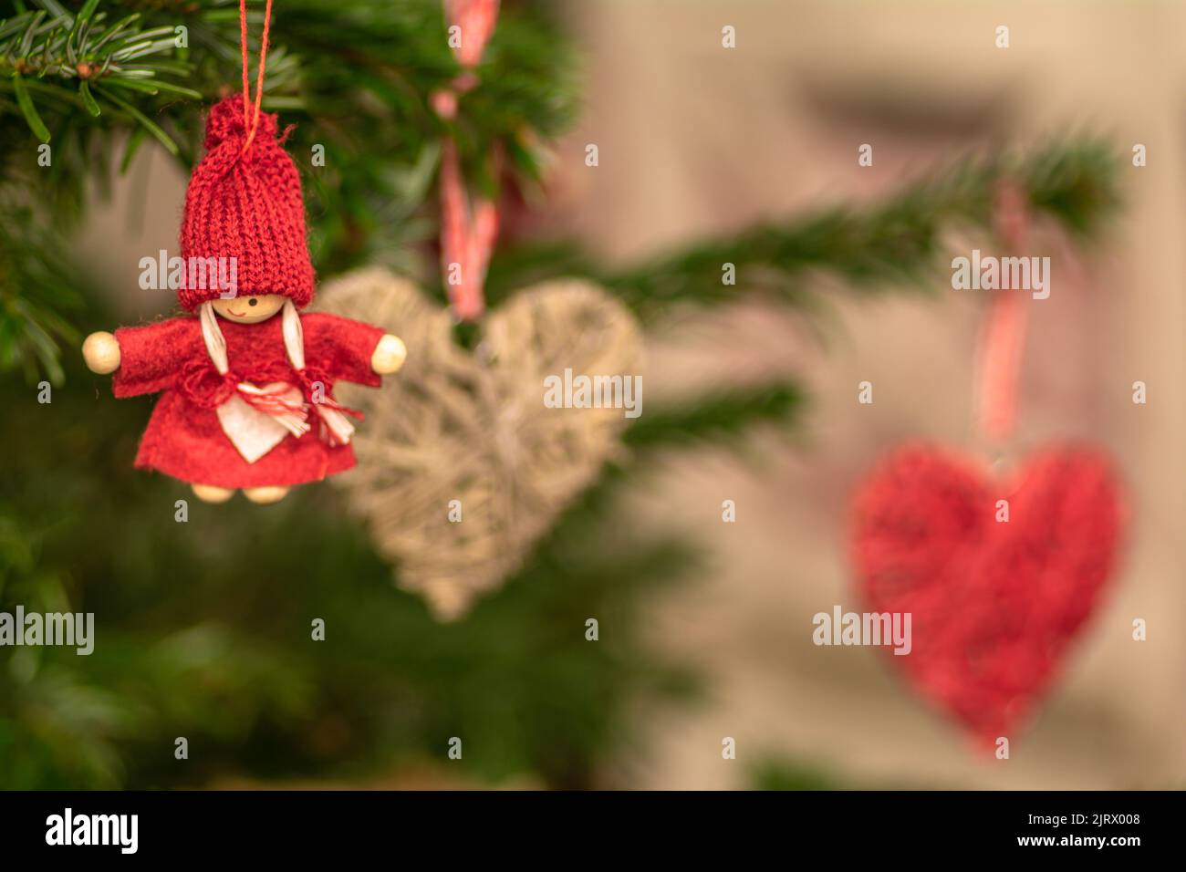 Red and brown Christmas tree branch decorations heart and doll stock ...