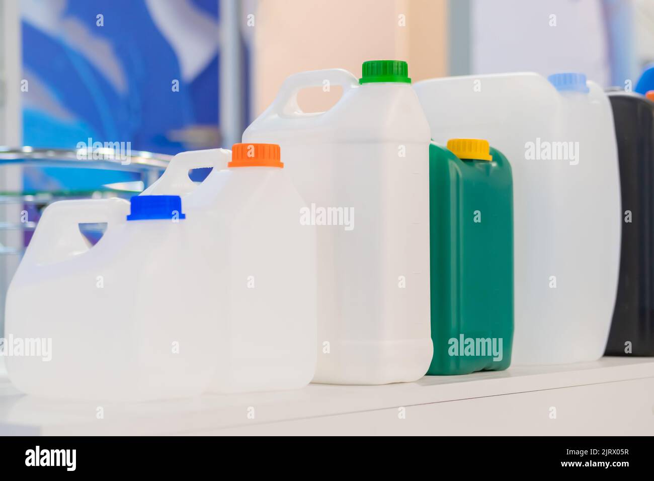 Row of empty plastic jerrycans at factory, exhibition - close up Stock ... Row of empty plastic jerrycans at factory, exhibition - close up Stock ...