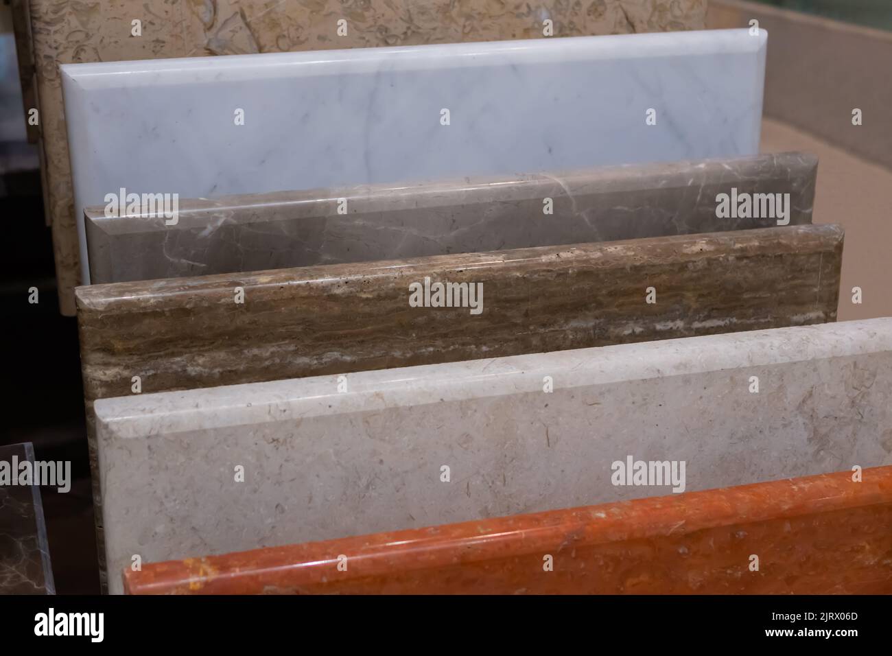 Colorful artificial stone slabs on counter for sale at hardware store ...