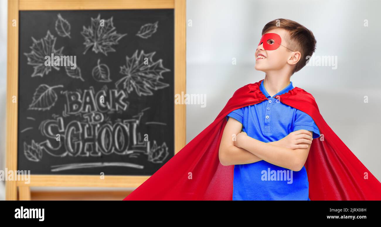boy in super hero costume over school blackboard Stock Photo - Alamy