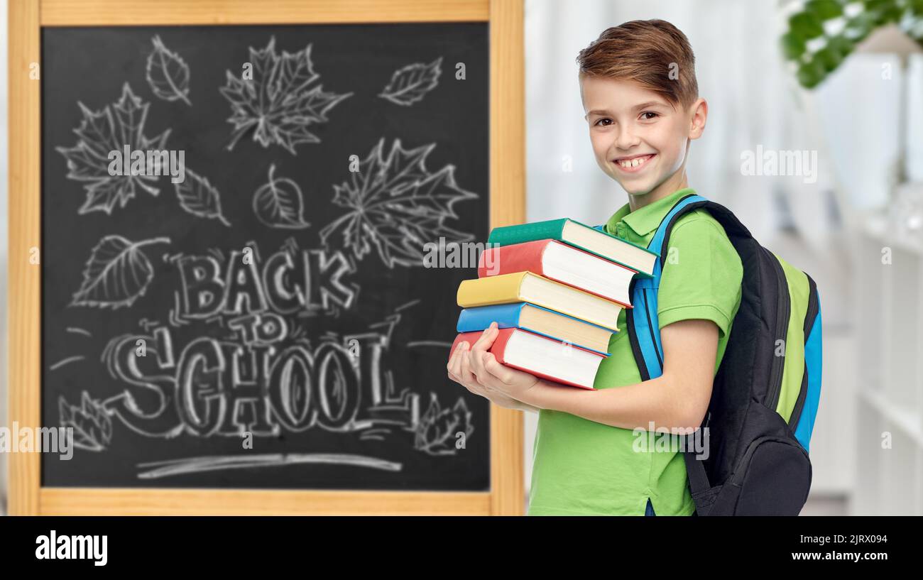 happy student boy with school bag and books Stock Photo - Alamy
