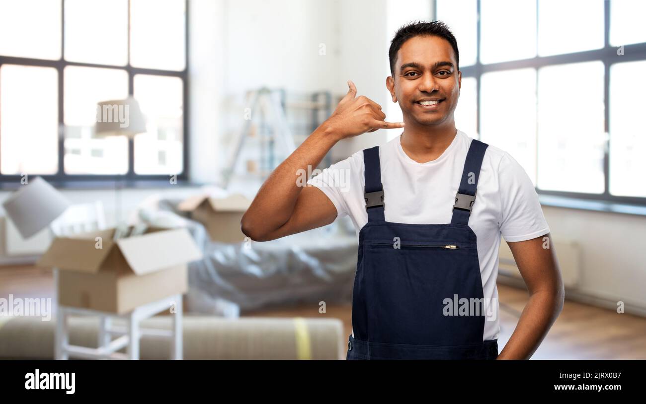 happy worker making phone call gesture at new home Stock Photo - Alamy
