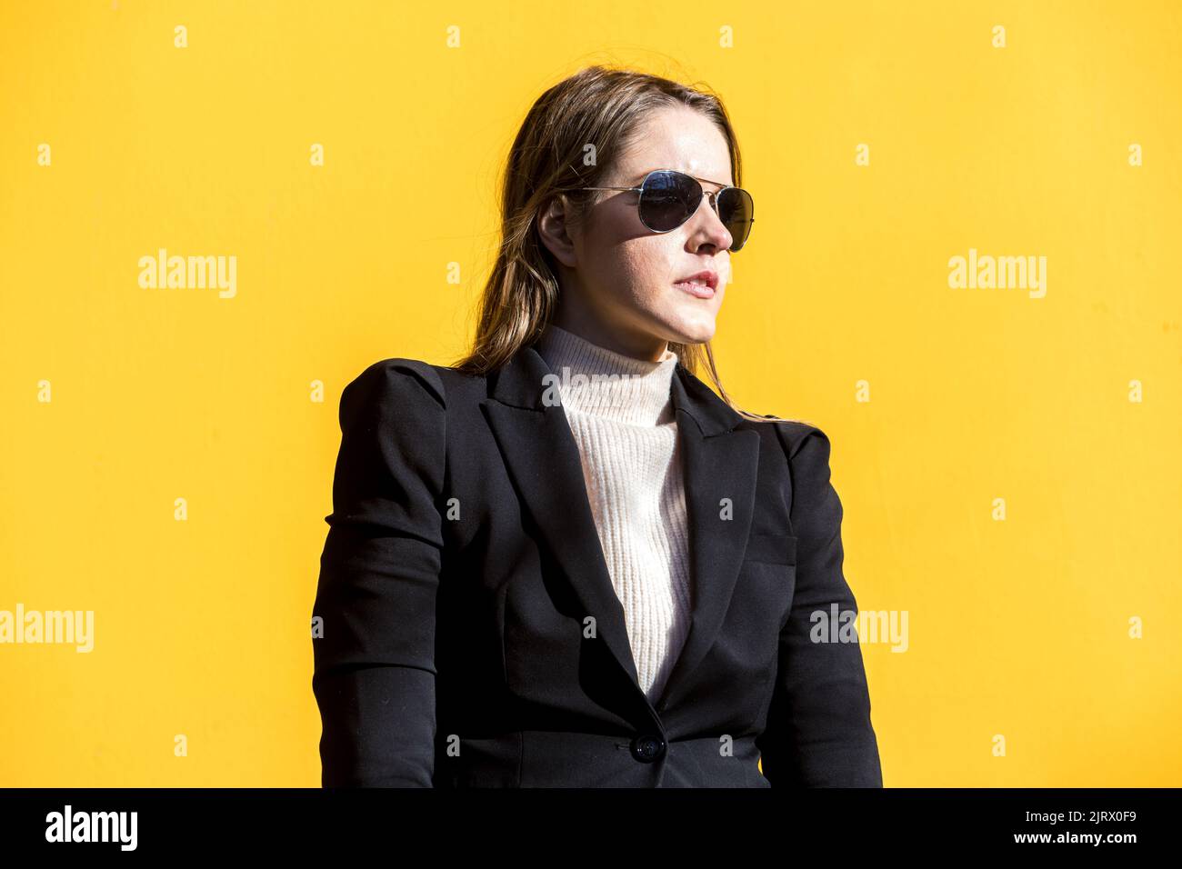 Executive entrepreneur woman, wearing black jacket and wool sweater and ...