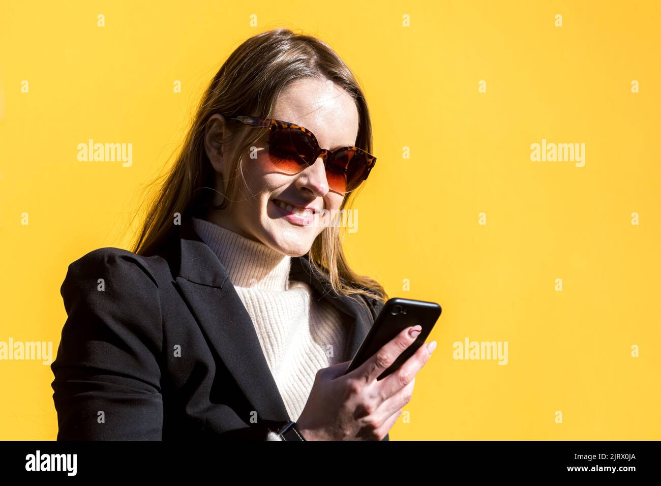 Executive entrepreneur woman, wearing black jacket and wool sweater and ...