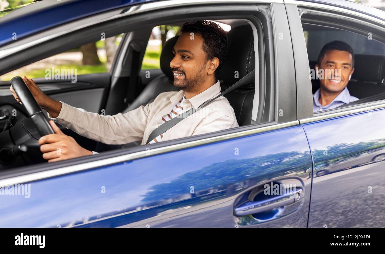 indian male driver driving car with passenger Stock Photo - Alamy