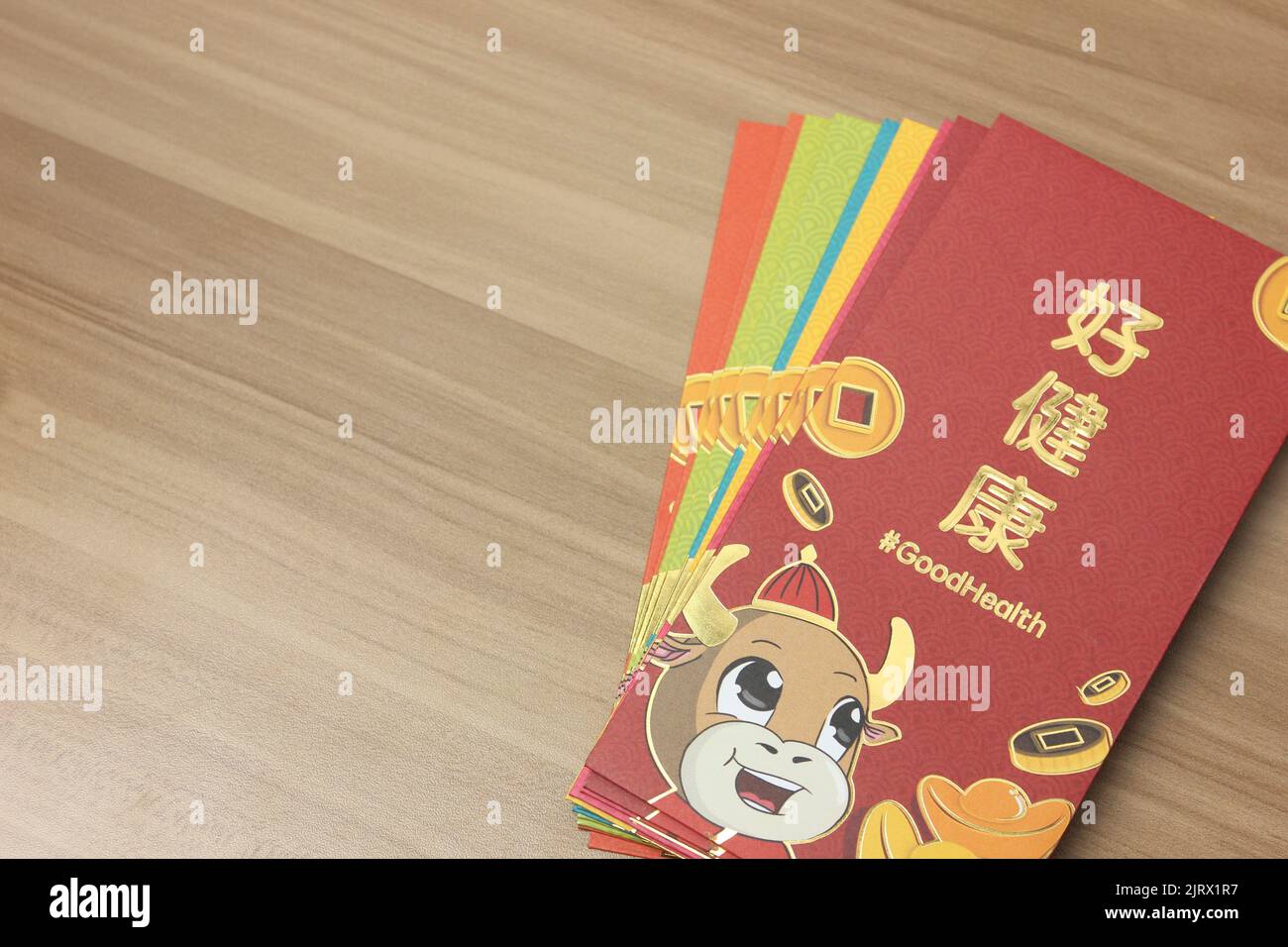 A closeup of traditional gift of red pockets (Hong bao) for children ...