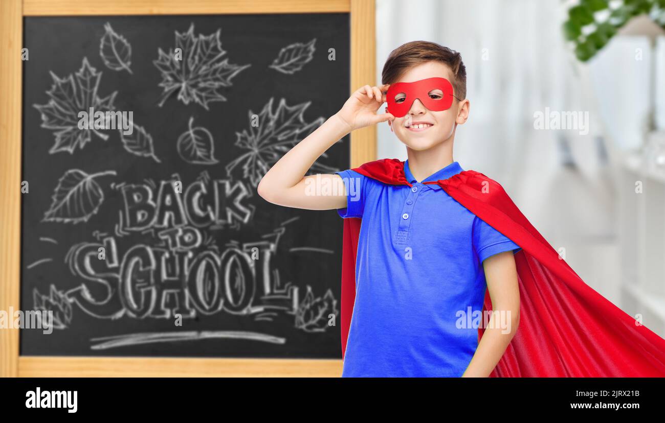 boy in super hero costume over school blackboard Stock Photo - Alamy