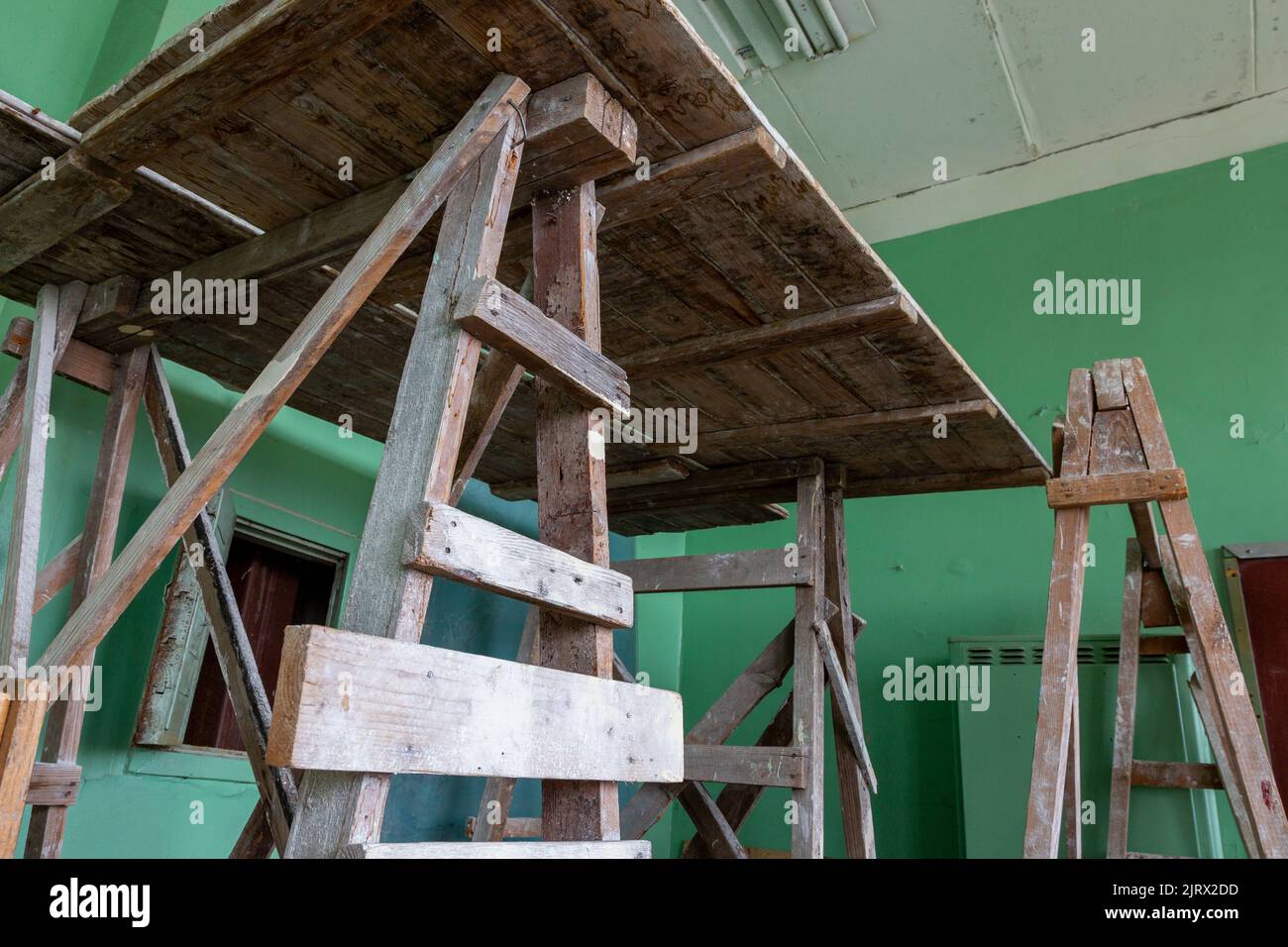 A fragment of the classroom interior with desks and construction ...