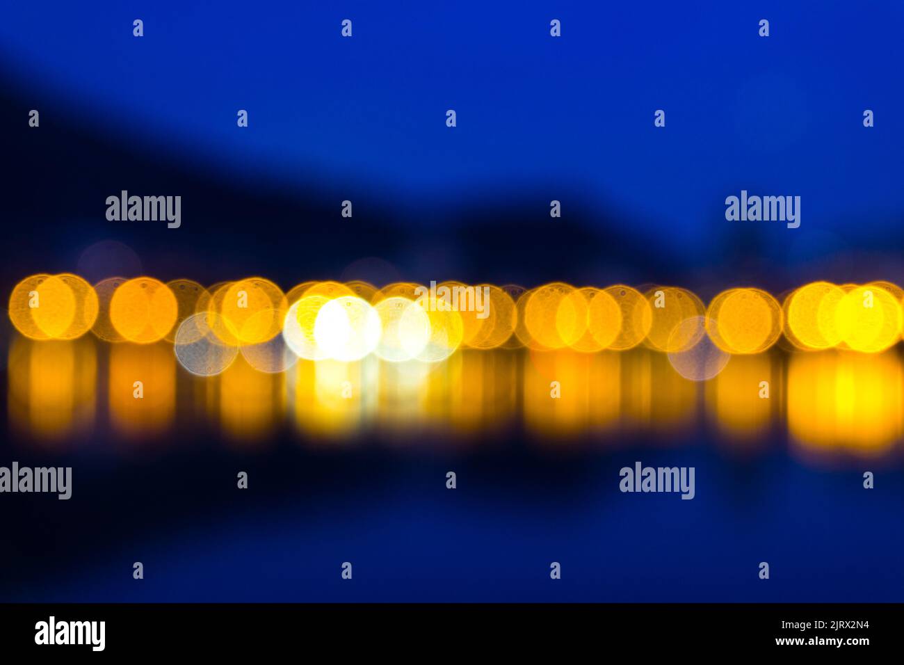 Dark blue screen background with blurred yellow lights in Rio de ...
