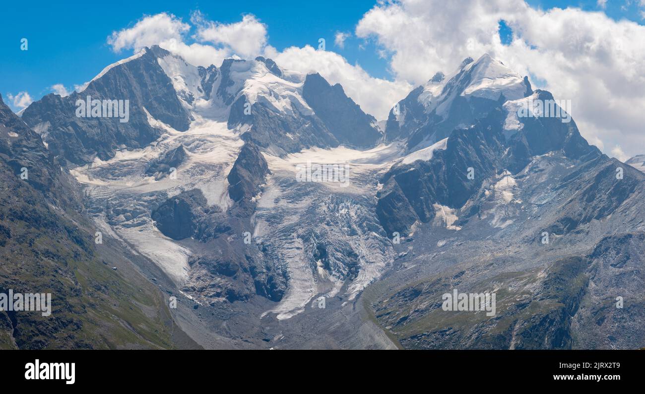 The panorama of Piz Bernina and Piz Roseg peaks Stock Photo - Alamy