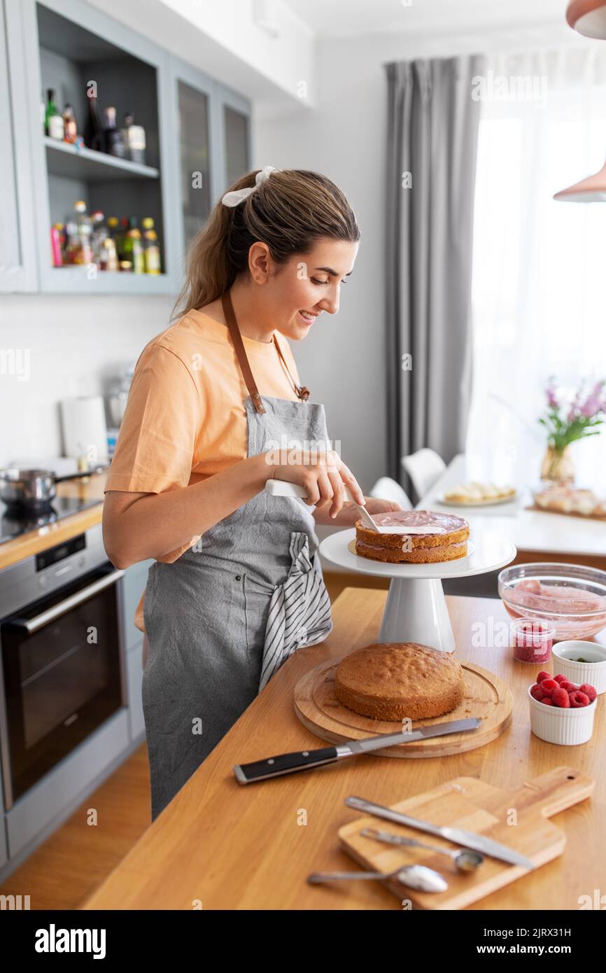 woman cooking food and baking on kitchen at home Stock Photo - Alamy