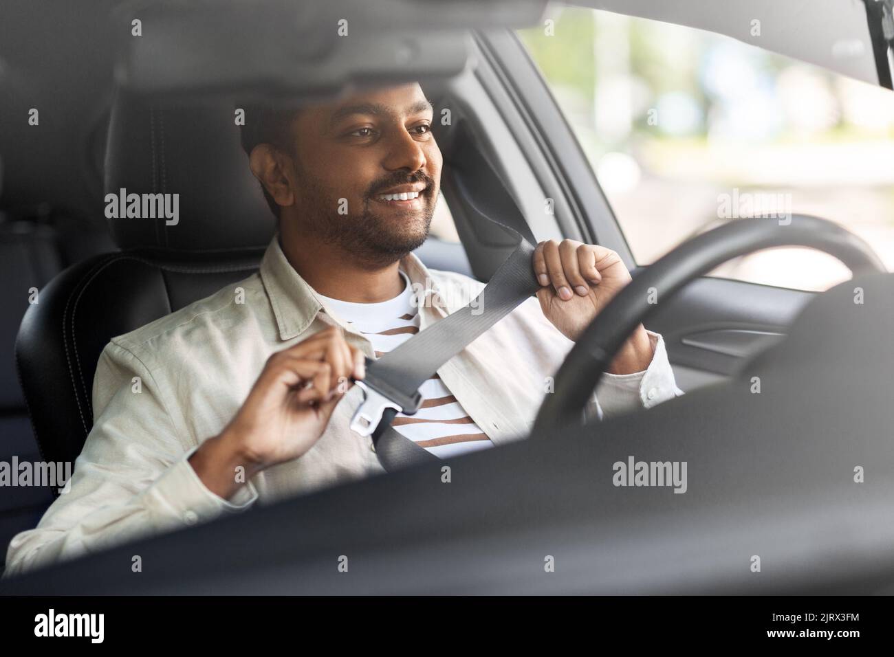 smiling indian man or driver driving car Stock Photo - Alamy