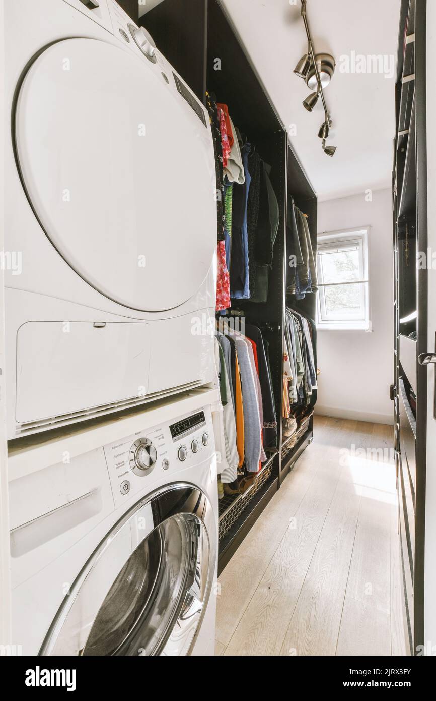 Interior of modern bright laundry room with white walls and floor Stock ...