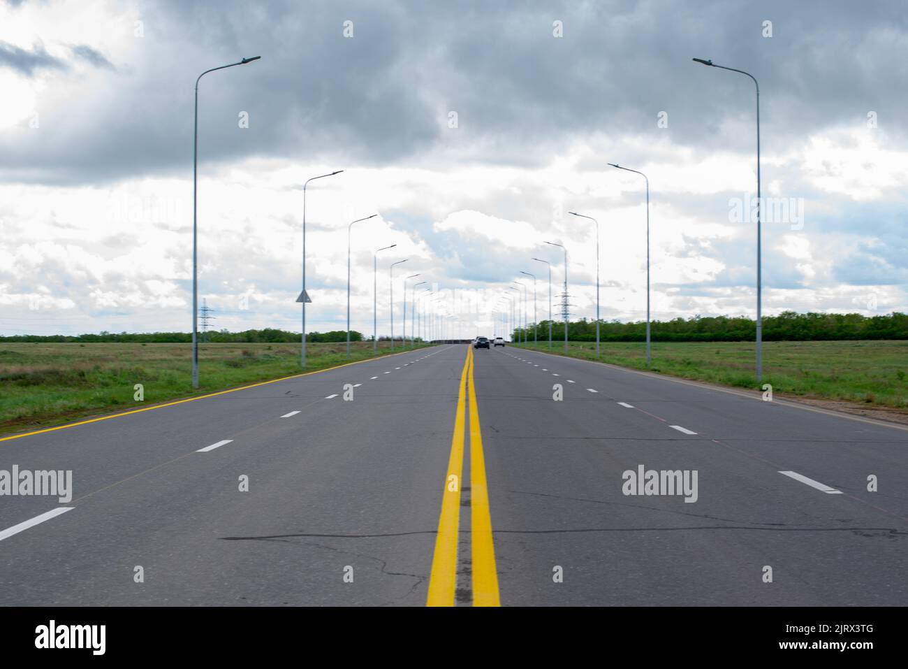 perspective of paved road and sky before rain Stock Photo - Alamy
