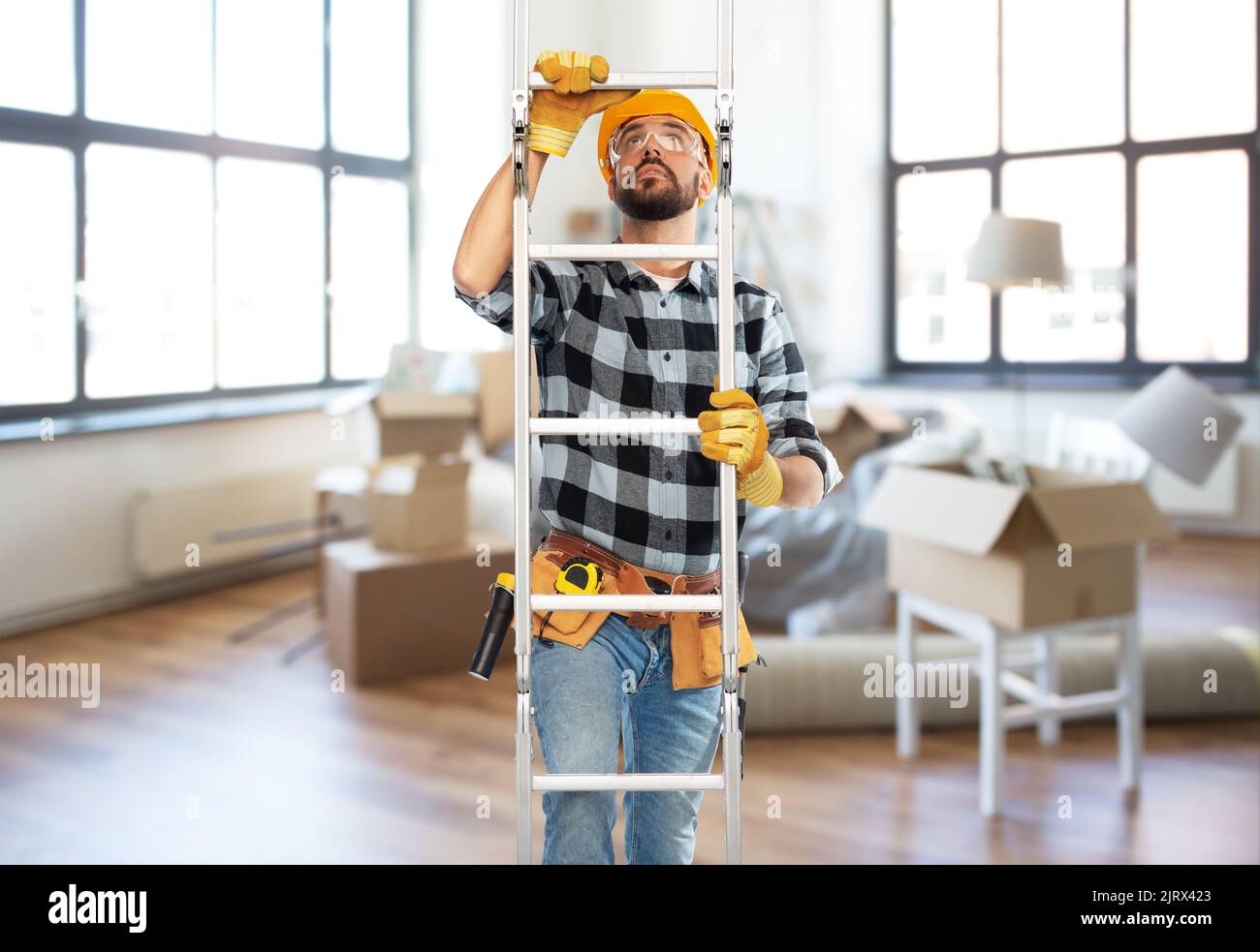 Man climbing ladder building repair hi-res stock photography and images ...