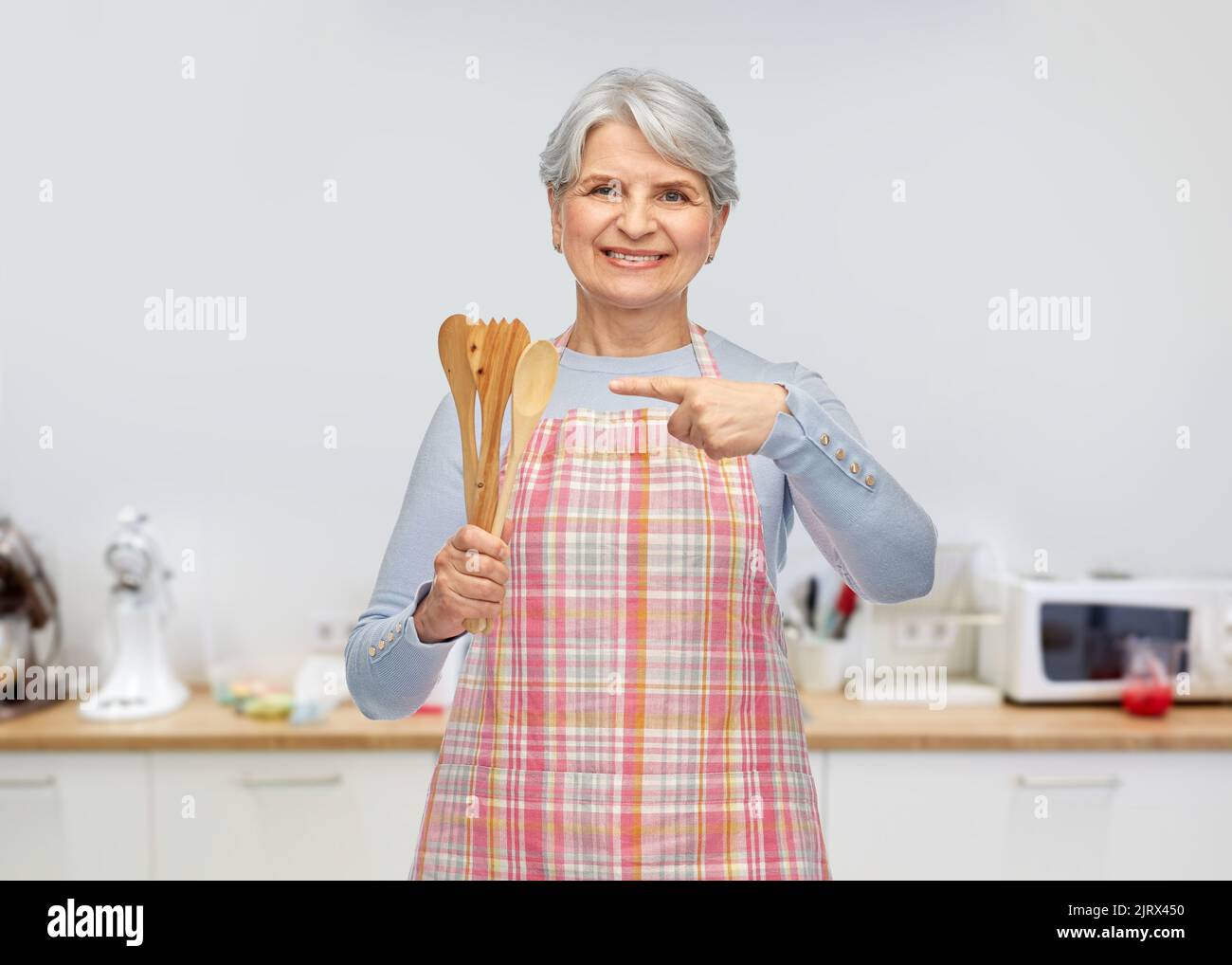 Old woman apron spatula hi-res stock photography and images - Alamy