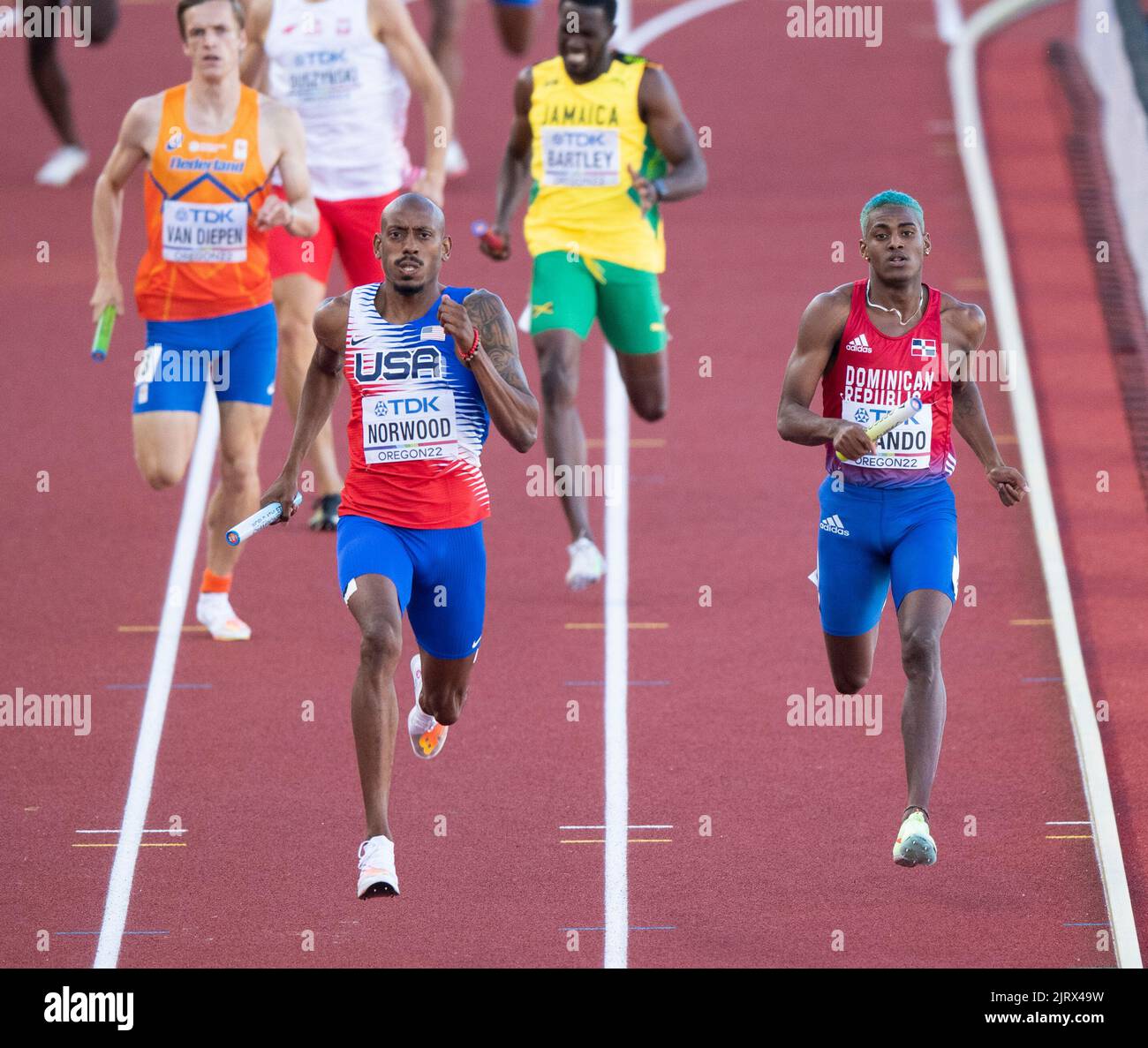 Alexander Ogando and Vernon Norwood competing in the mixed relay final ...