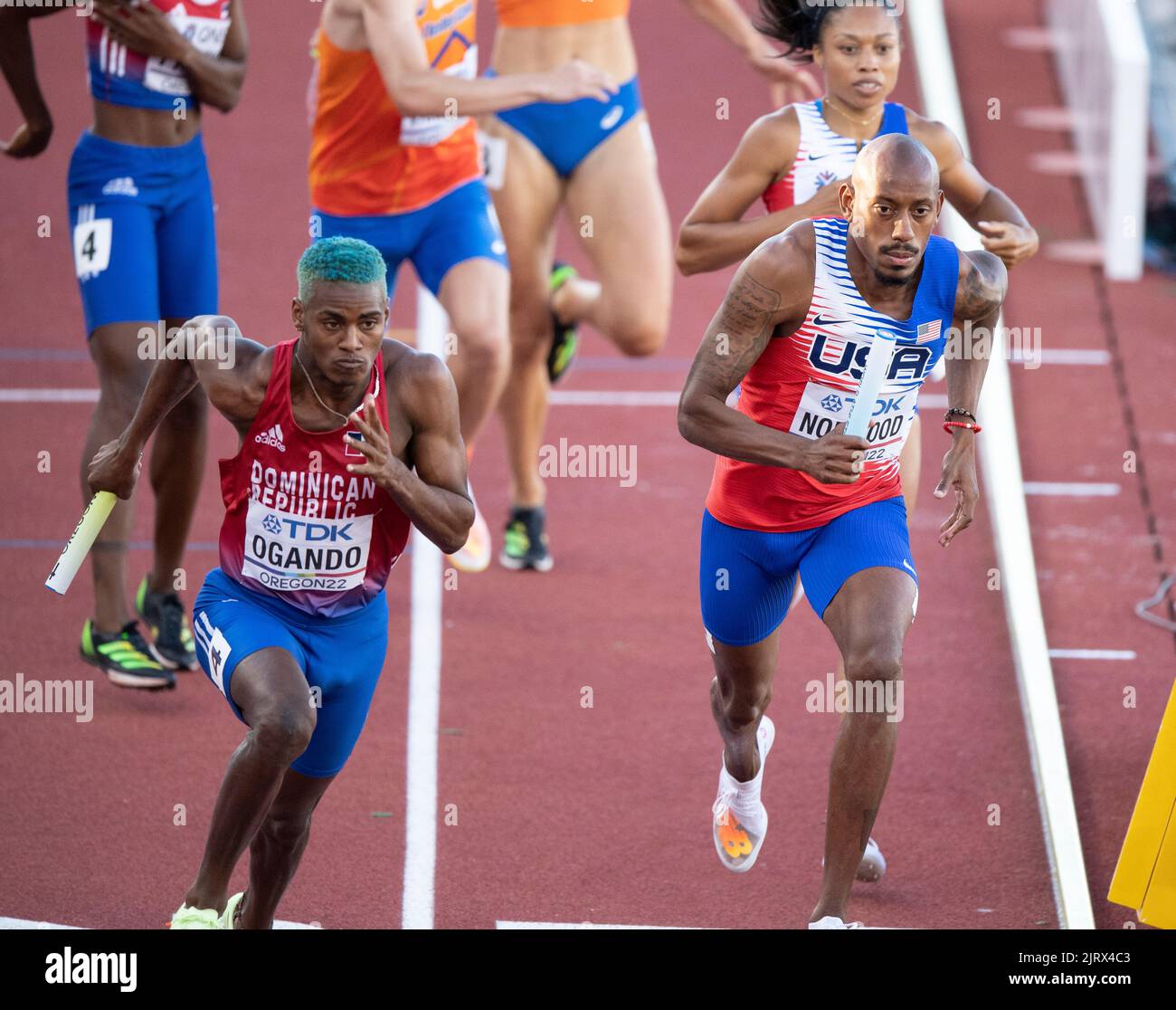 Alexander Ogando and Vernon Norwood competing in the mixed relay final ...