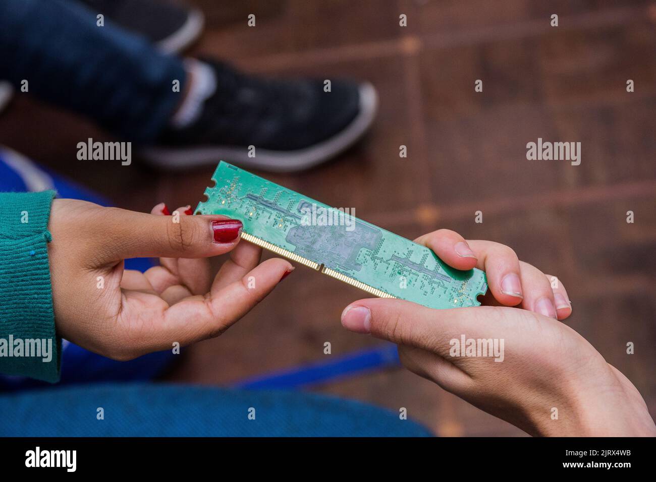 man and woman holding computer memory comb in Brazil Stock Photo - Alamy