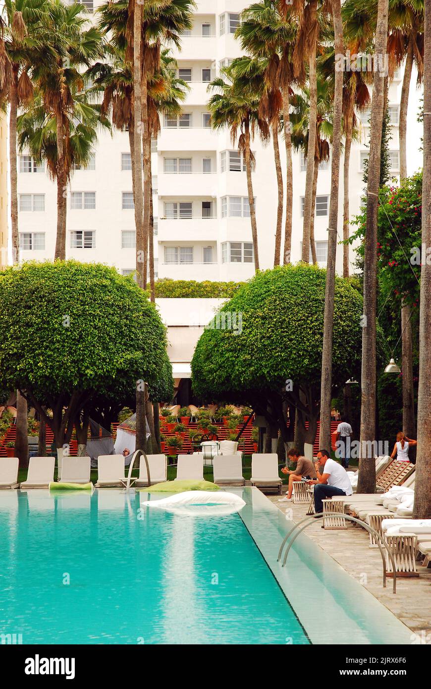 The Swimming pool at the Historic Art Deco Delano Hotel is surrounded ...