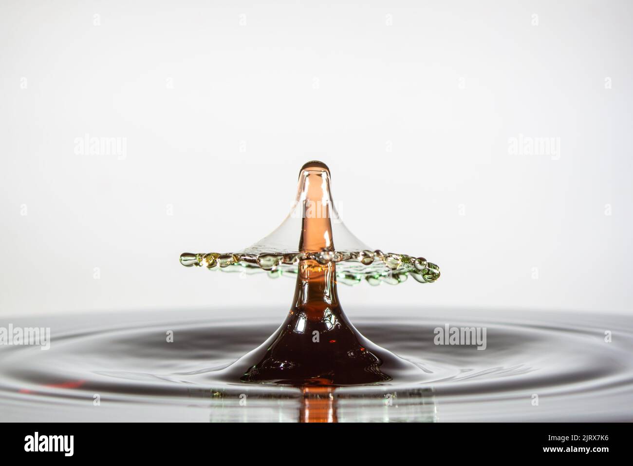 A scenic view of a water splash on a light grey background Stock Photo ...