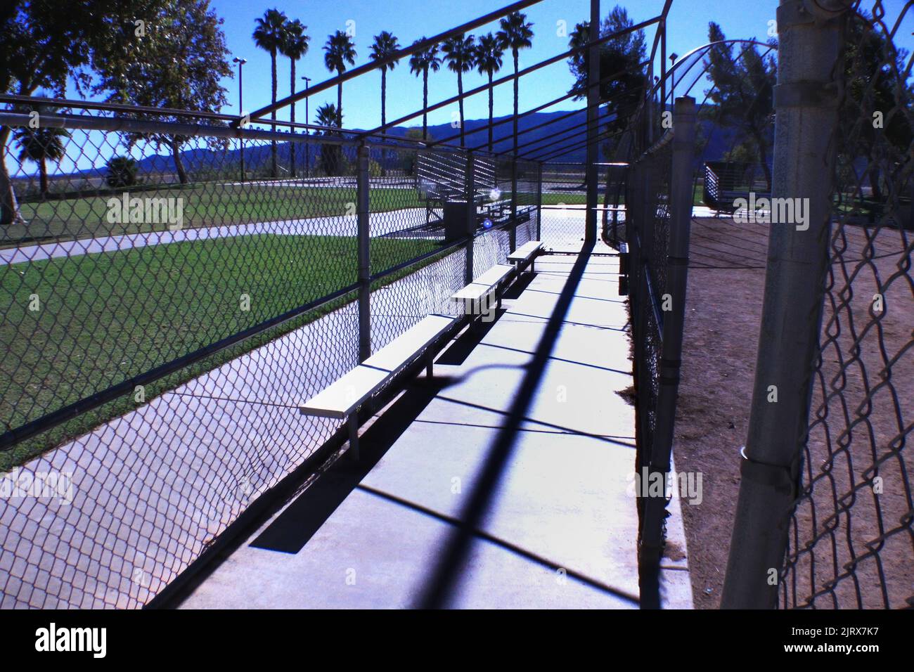 Empty baseball and softball dugout with bench at public park Stock ...