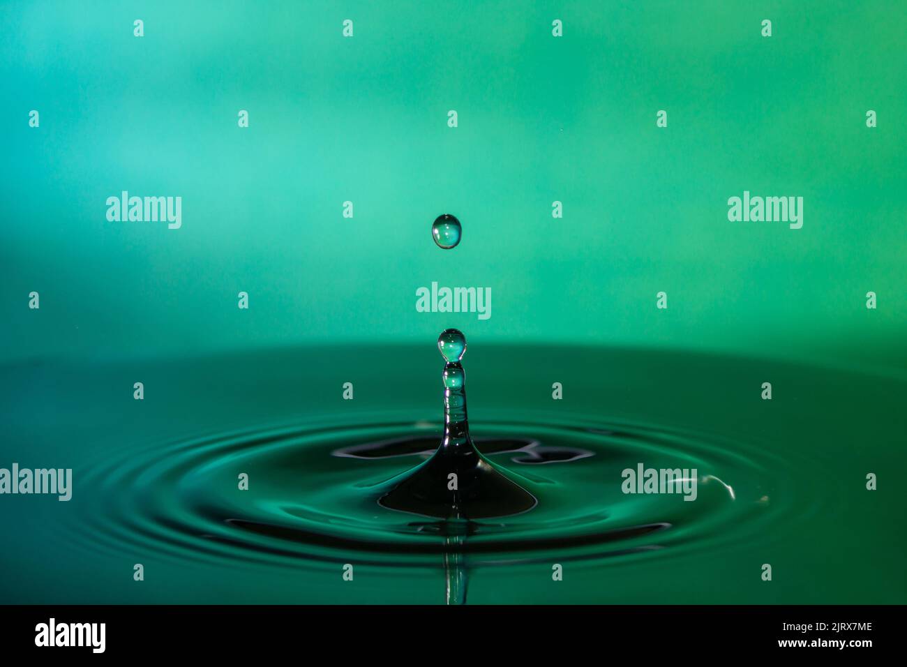 A scenic view of a water splash in green Stock Photo - Alamy