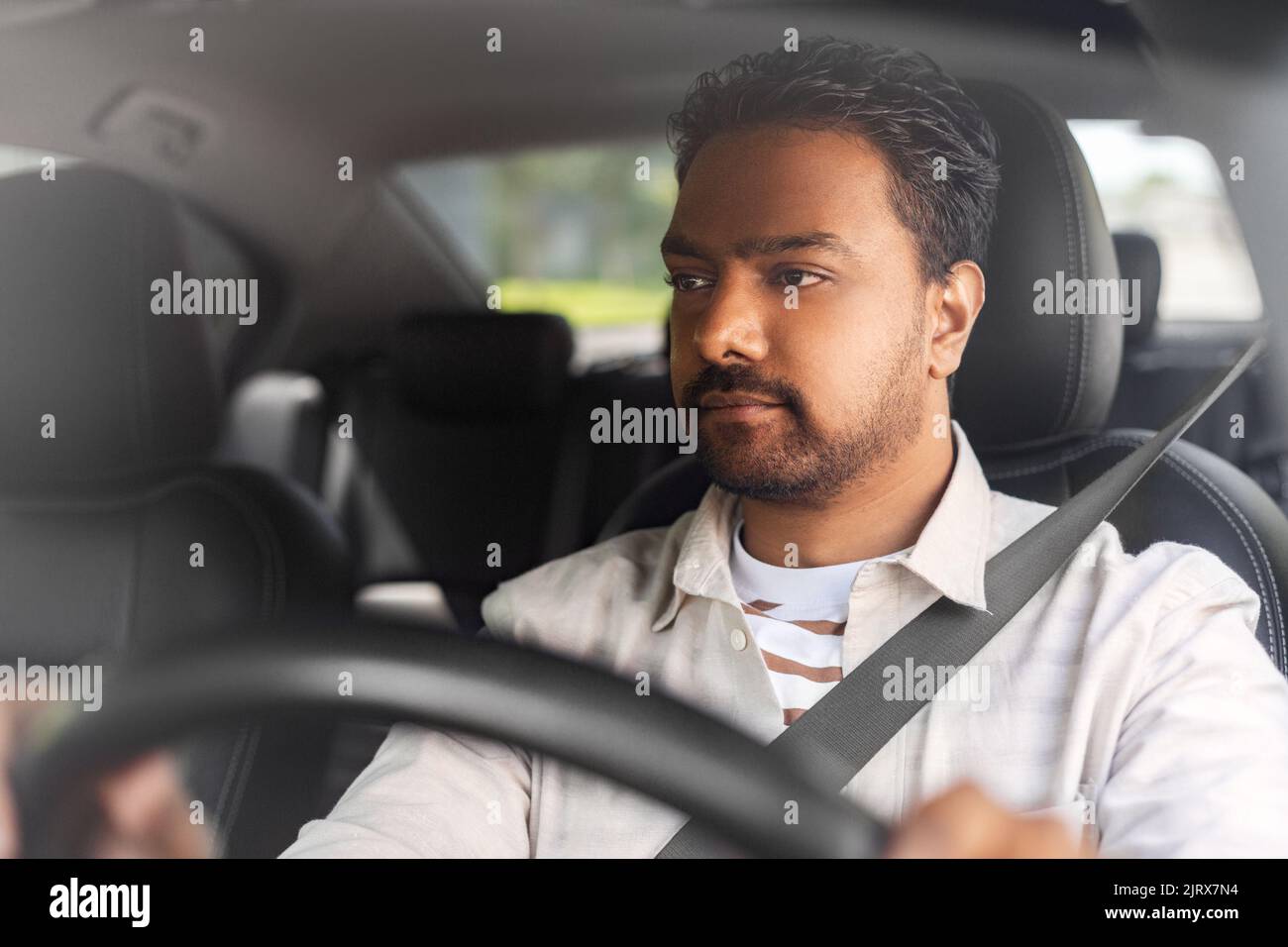 Indian man sitting inside car hi-res stock photography and images - Alamy