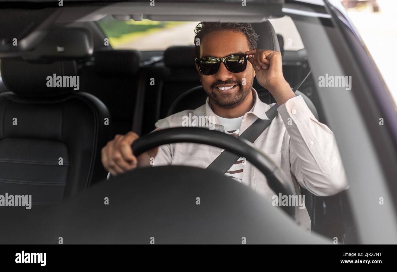 Driver smiling sunglasses car hi-res stock photography and images - Alamy