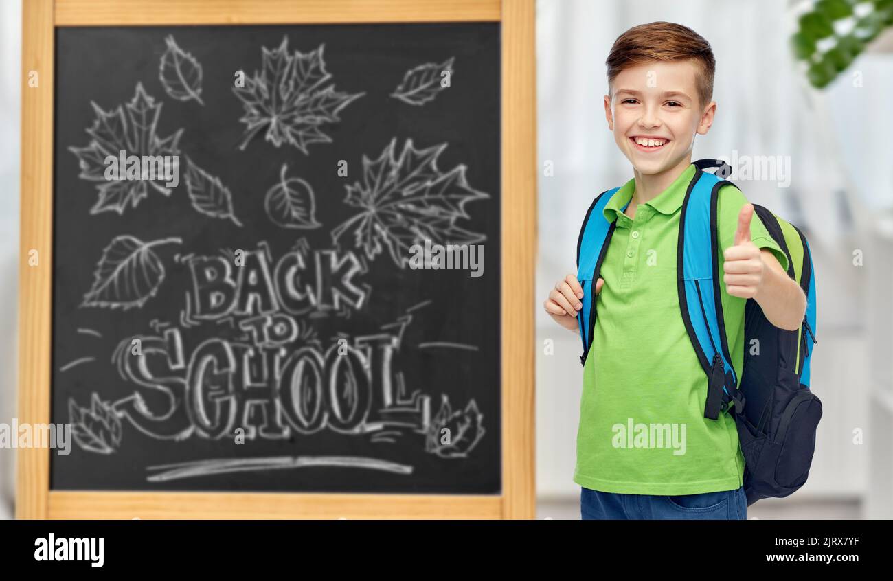happy student boy with school bag over chalkboard Stock Photo - Alamy