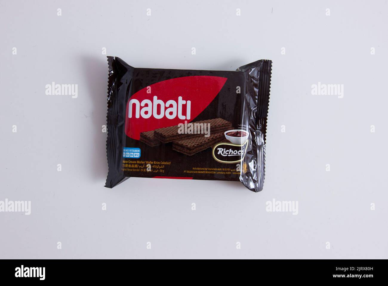 A closeup of a chocolate Nabati wafer bar on a white table background ...