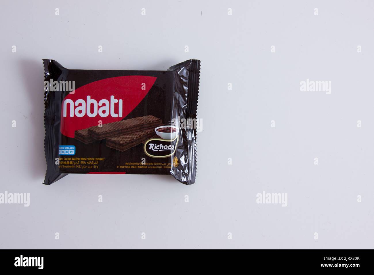 A closeup of a chocolate Nabati wafer bar on a white table background ...