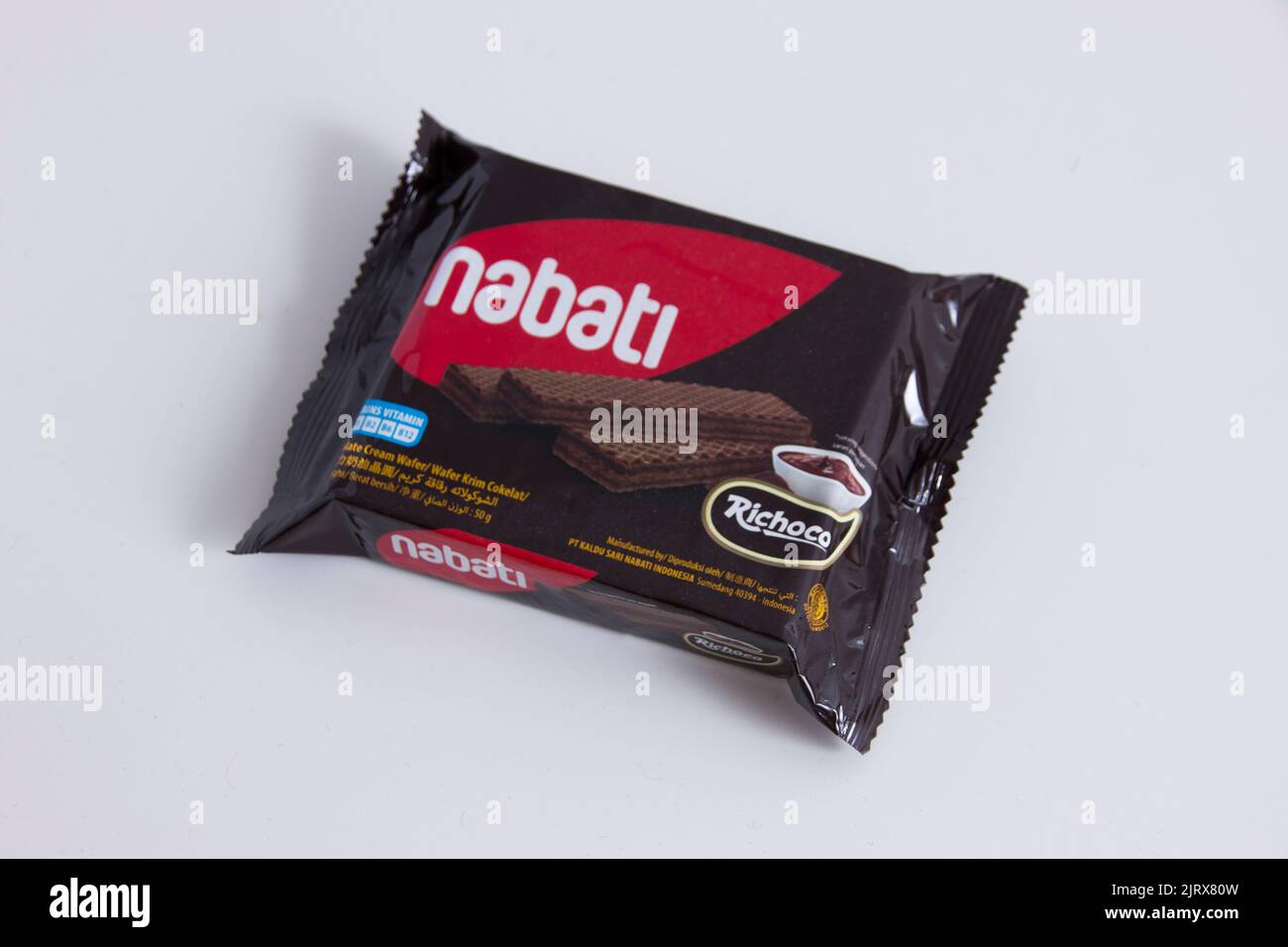 A closeup of a chocolate Nabati wafer bar on a white table background ...