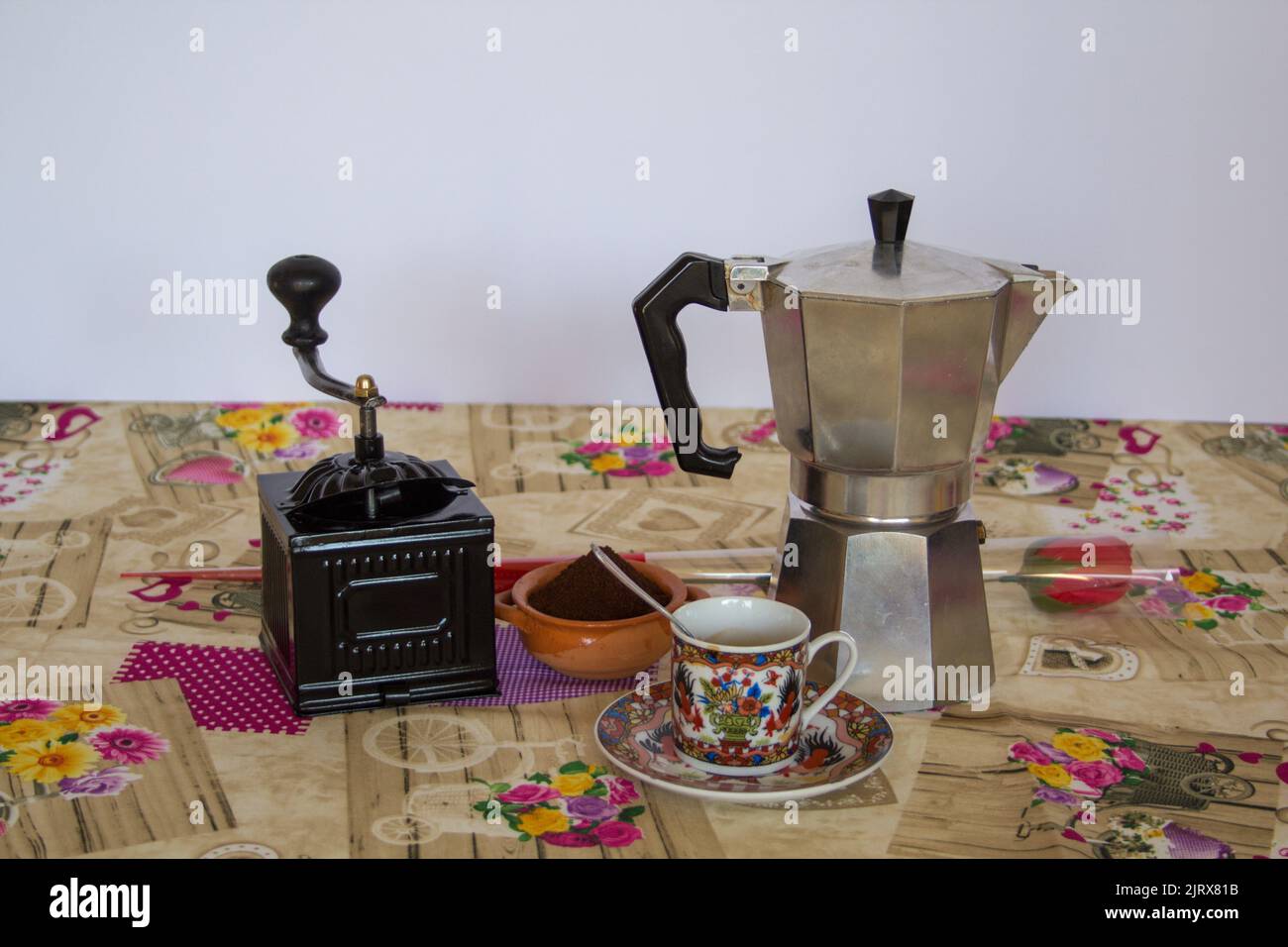 Image of a coffee cup, a coffee grinder and a mocha machine. Breakfast ...