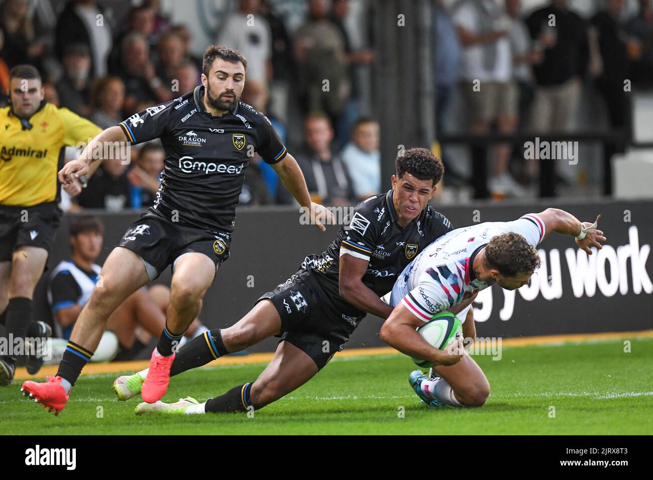 Henry Purdy of Bristol Bears is tackled by Rio Dyer of Dragons Rugby ...