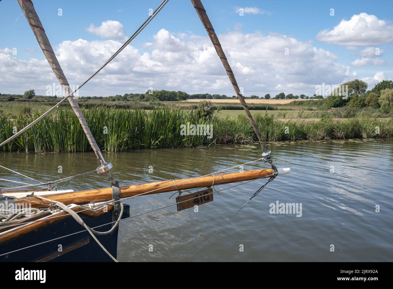 The front end or bow of a traditional sailing boat moored against the ...