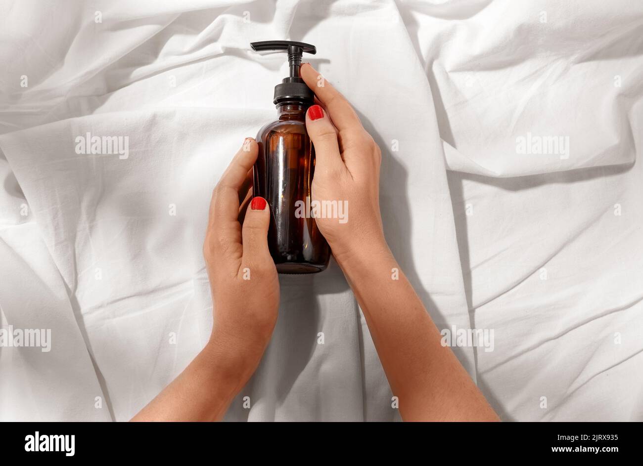 hands with bottle of shower gel or liquid soap Stock Photo - Alamy