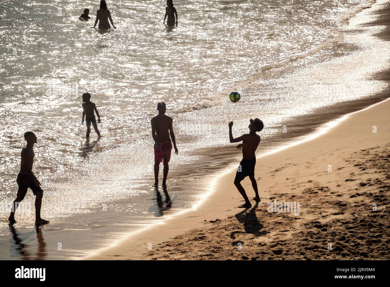 A view of people at Paciencia beach in Salvador having fun and ...