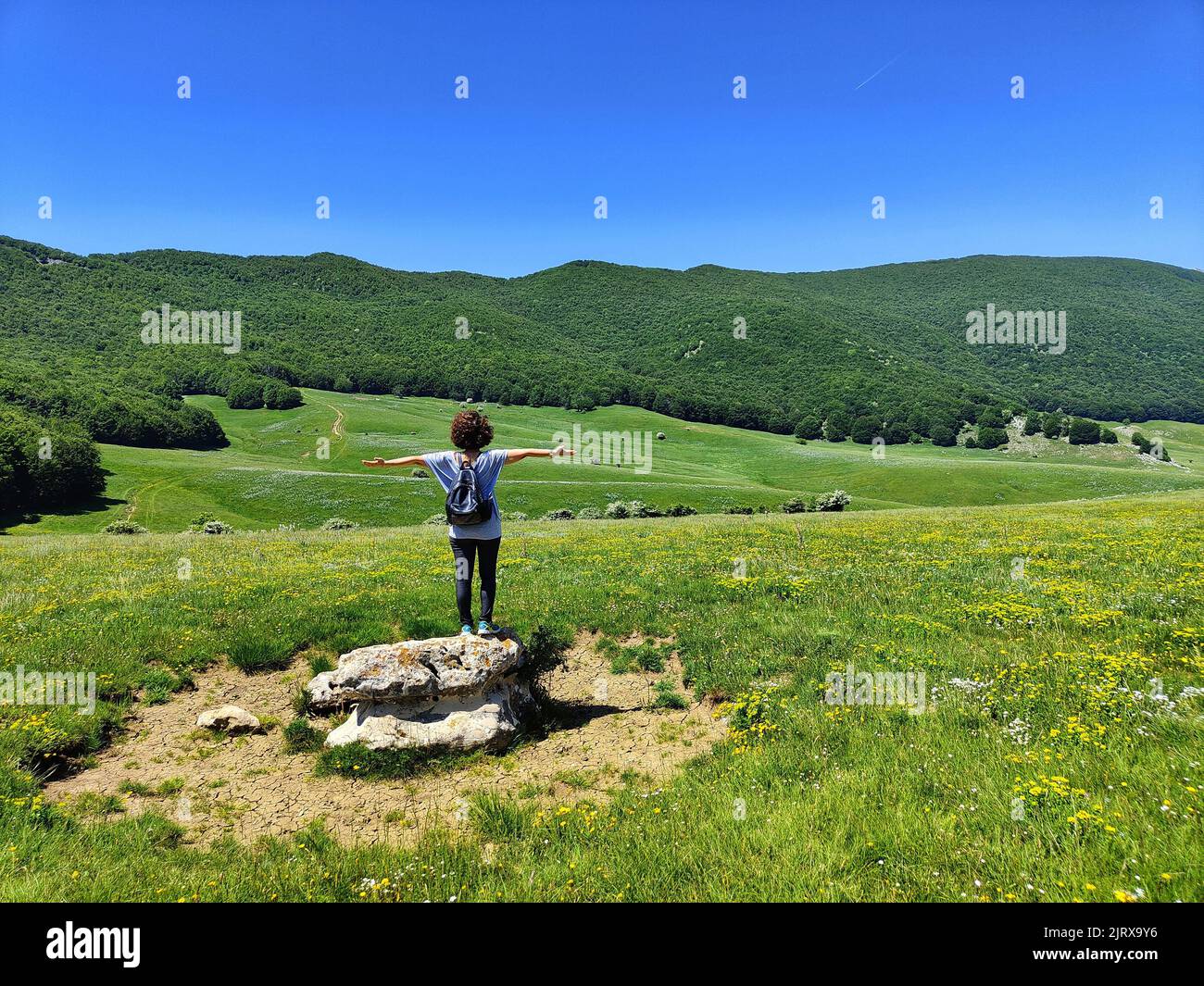 A hiker admiring nature in Voltigno in Abruzzo Stock Photo - Alamy