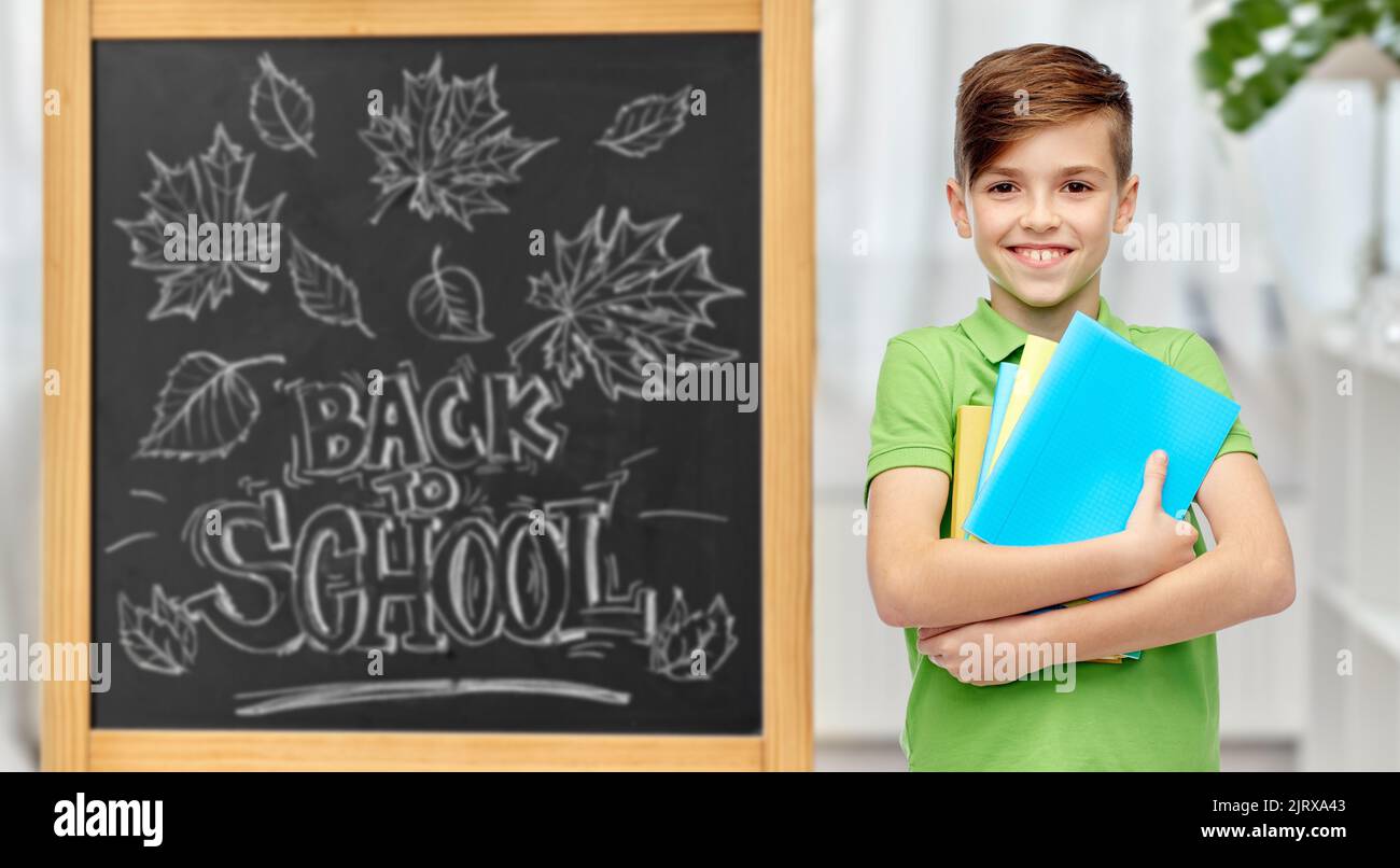 happy student boy with folders and notebooks Stock Photo - Alamy