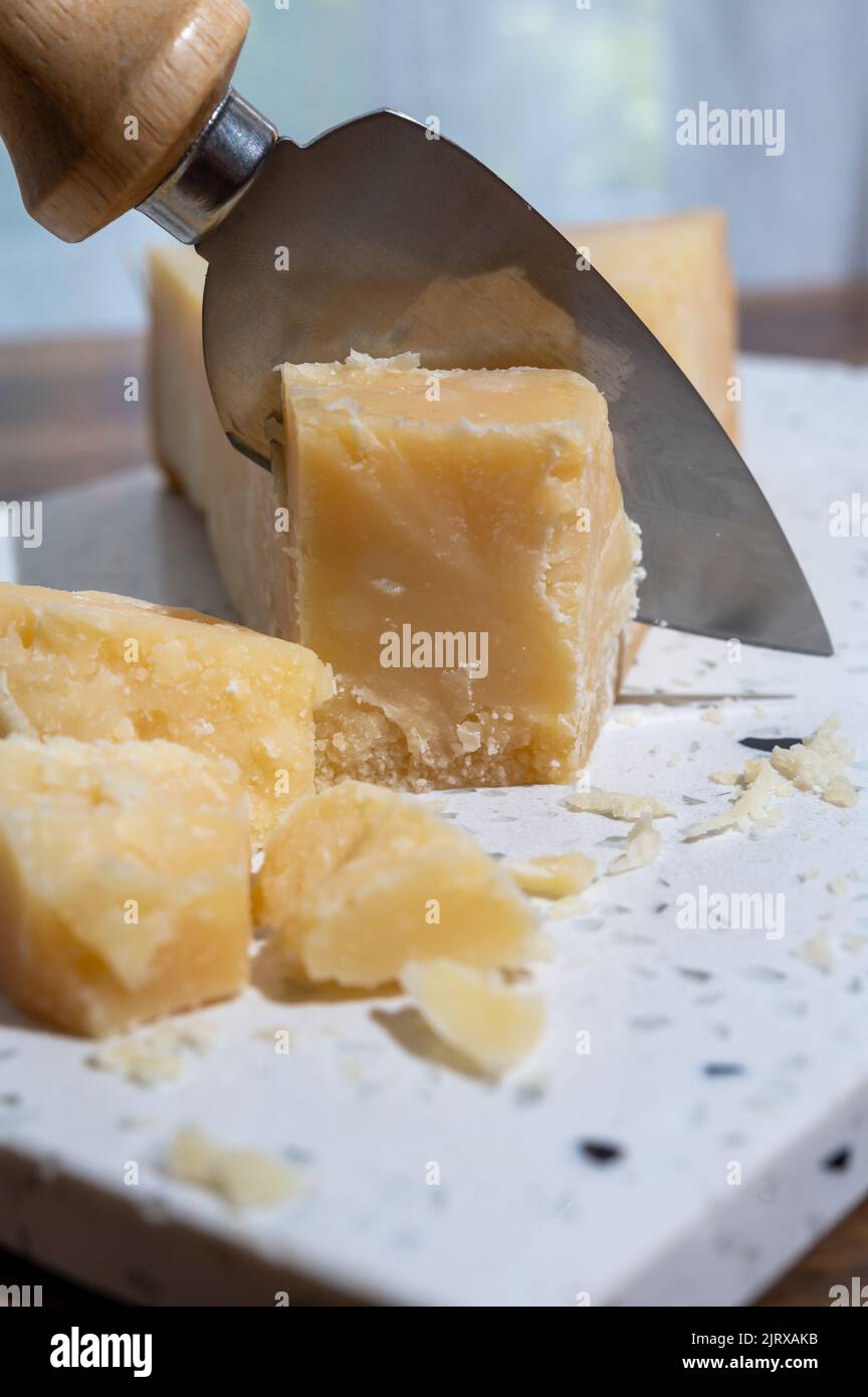 Italian cheese collection, piece of old matured grana padana cheese ...