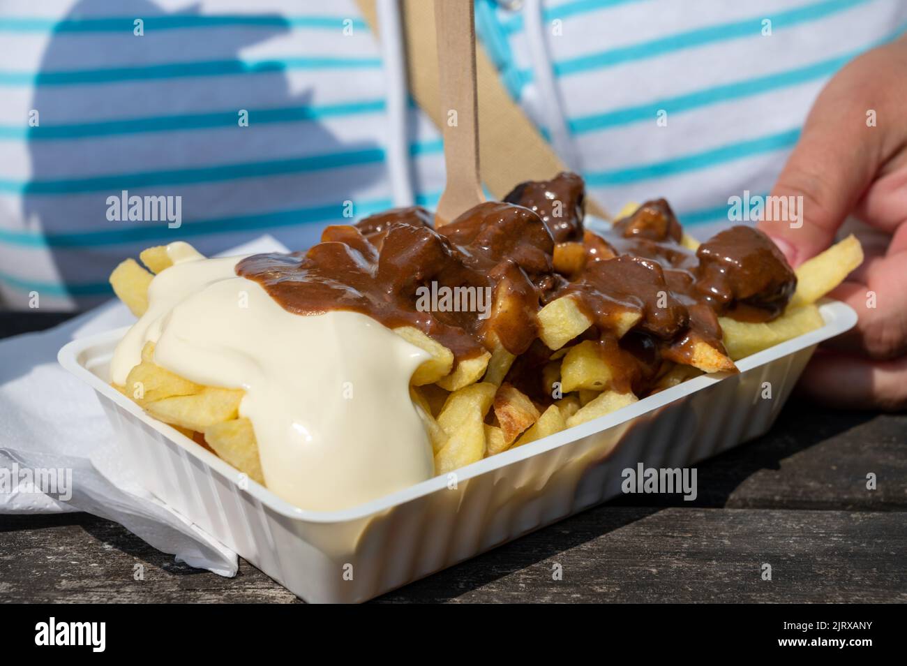 Traditional fast and street food in Belgium, French fried potatoes with ...