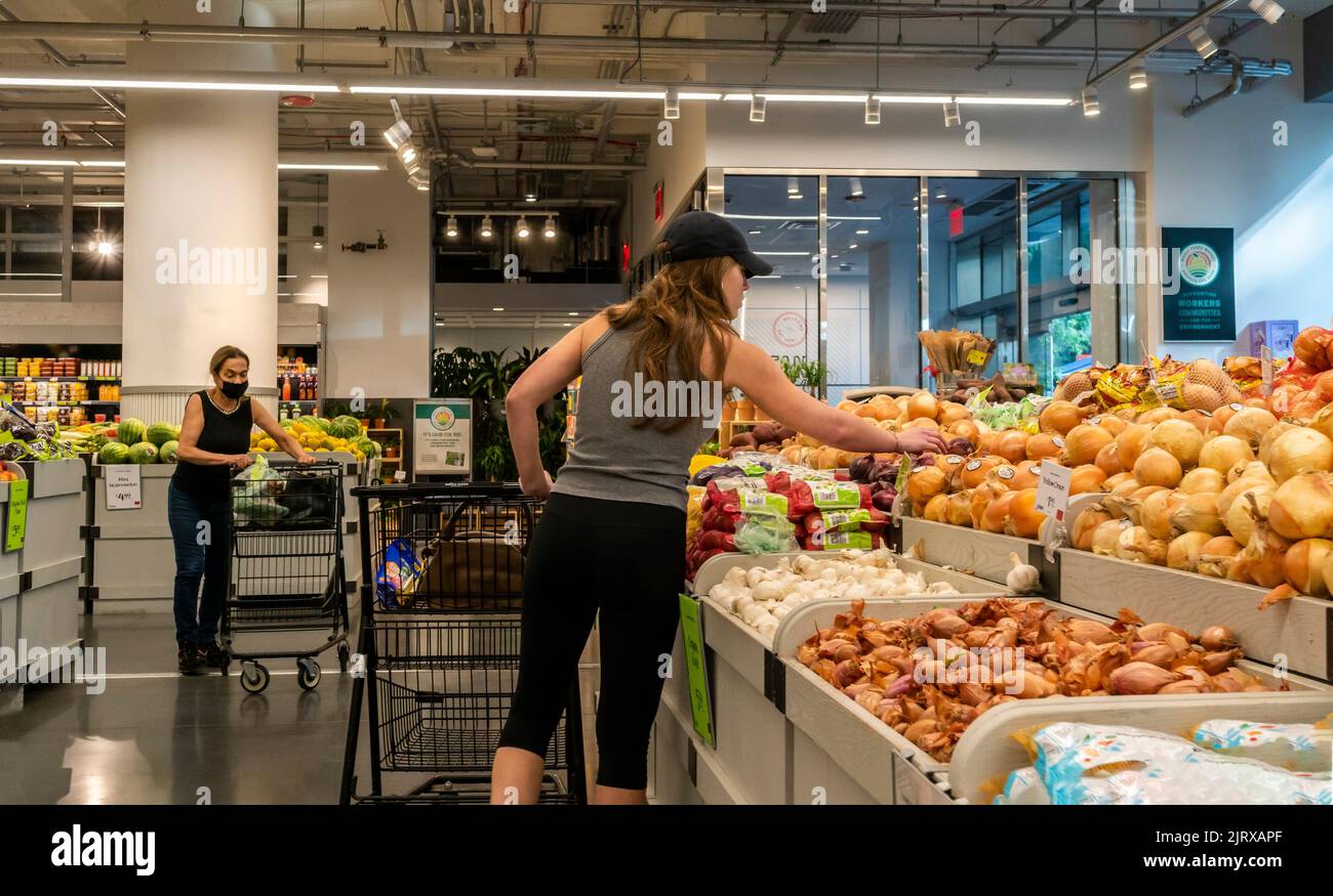 Shopping in a Whole Foods Market supermarket in New York on Monday ...