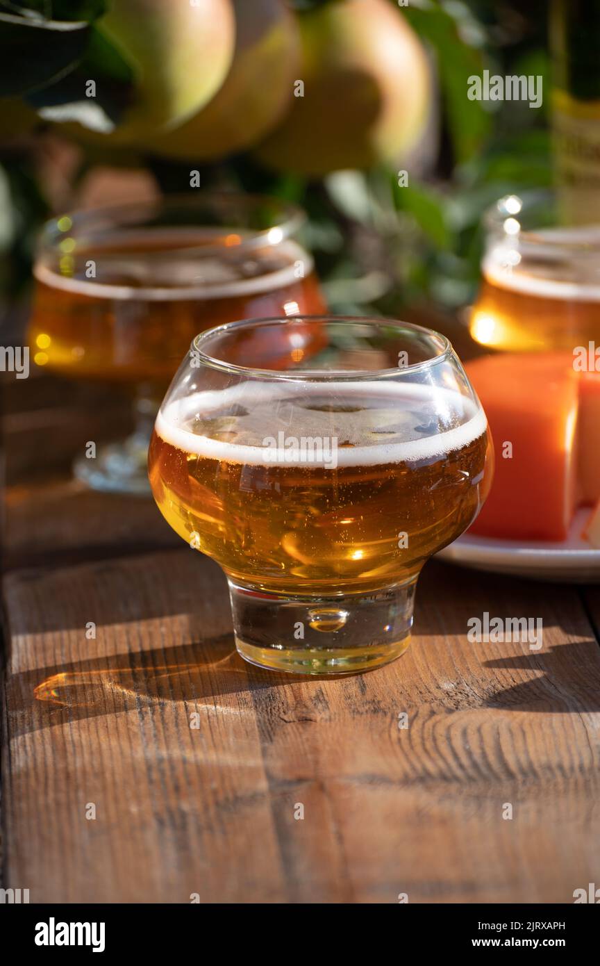 Food and drink pairing, apple cider in glasses produced on organic farm ...