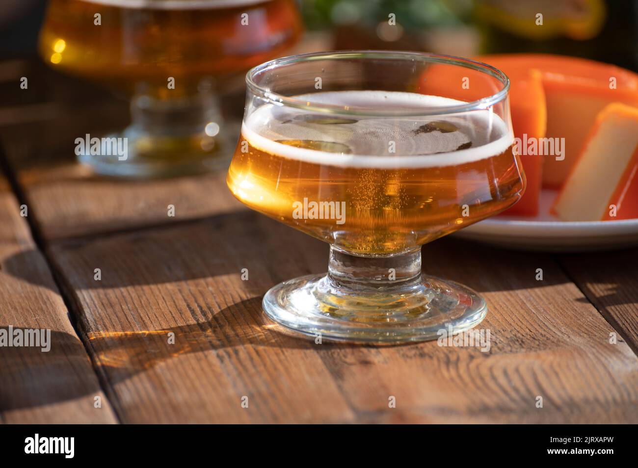 Food and drink pairing, apple cider in glasses produced on organic farm ...