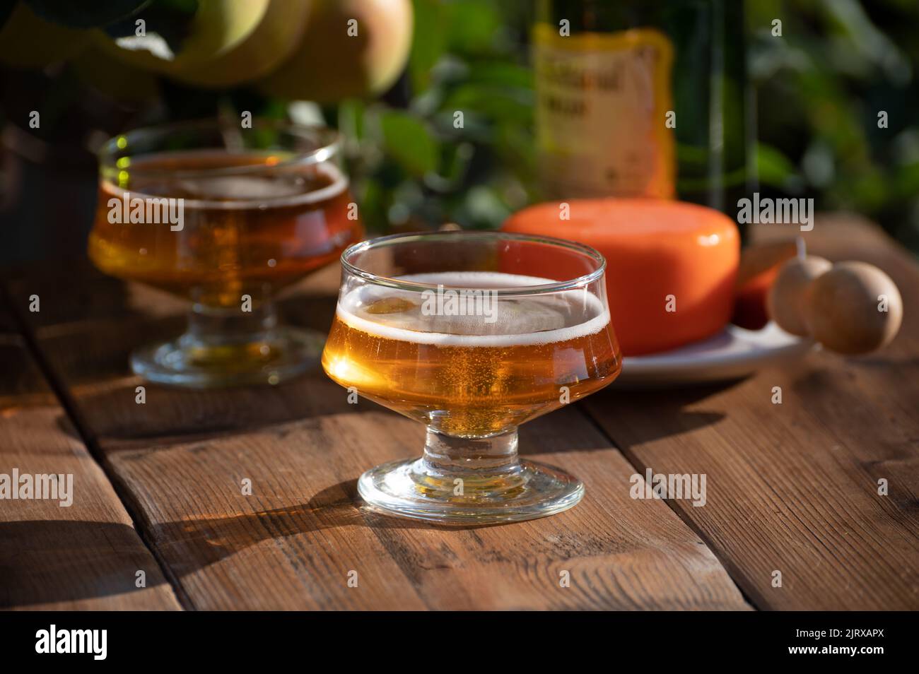 Food and drink pairing, apple cider in glasses produced on organic farm ...