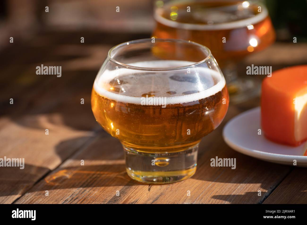 Food and drink pairing, apple cider in glasses produced on organic farm ...