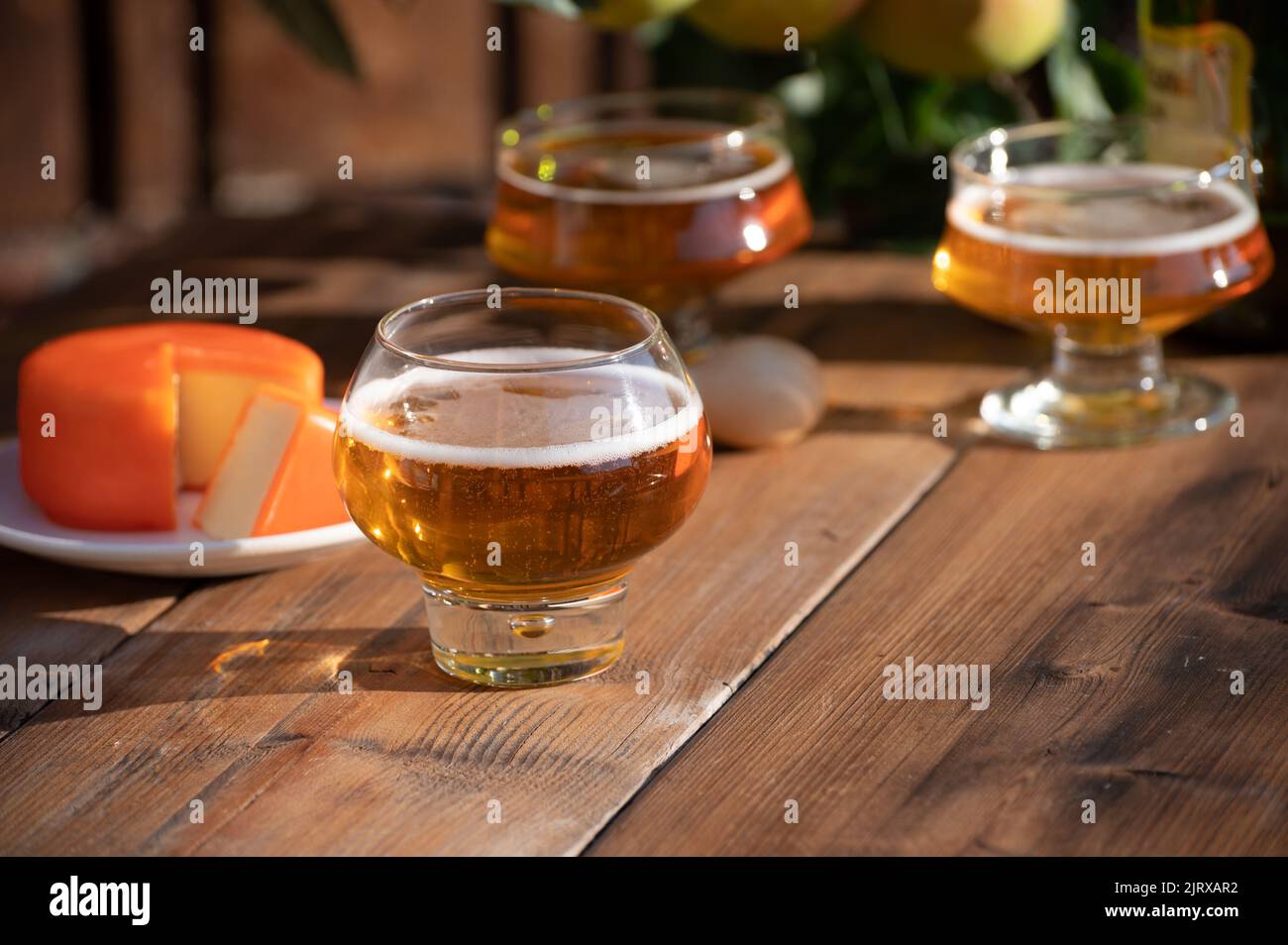 Food and drink pairing, apple cider in glasses produced on organic farm ...